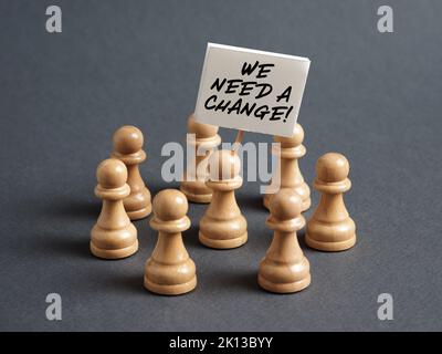 Chess pawn protester holding a sign banner with the message FREE SPEECH ...