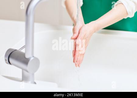 Japanese senior woman washing hands Stock Photo - Alamy