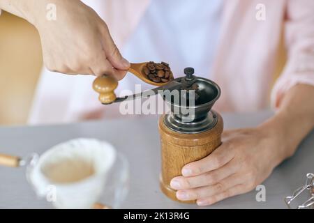 Japanese man grinding coffee at home Stock Photo - Alamy