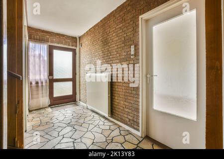 Perspective view of empty narrow hallway with white walls and wardrobe ...