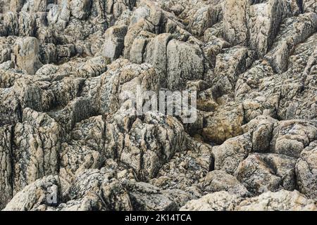 natural stone background, the remains of lava basalt columns form a ...
