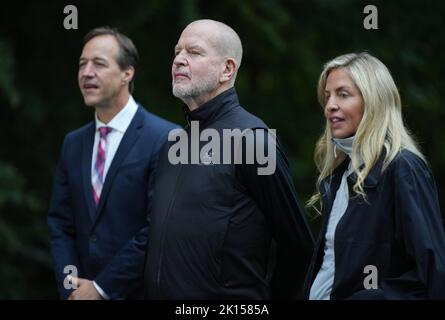 Lululemon founder Chip Wilson, centre, and his wife Summer Wilson stand ...