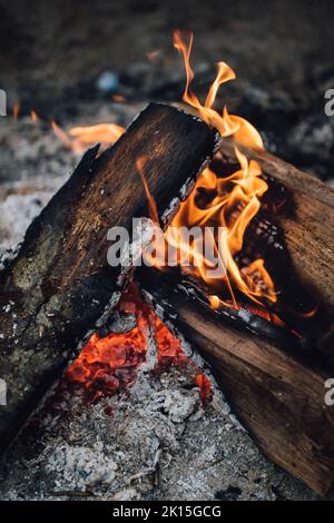 A roaring fire with orange and black flames in the middle Stock Photo ...