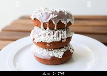 Homemade iced doughnuts with jimmies Stock Photo - Alamy