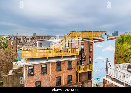 Baltimore, Maryland, famous row houses are often topped with rooftop ...