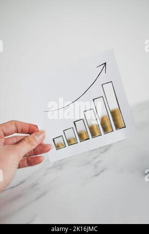 cutout graph with stats going up on blue background, concept of ...