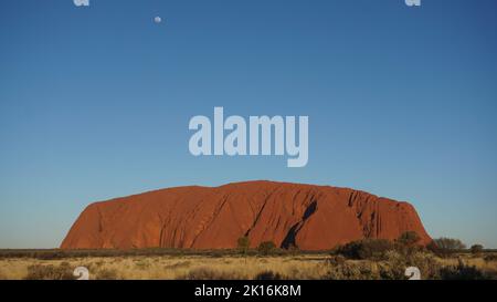 A beautiful view of Uluru at Sunset. As the sun goes down the ...