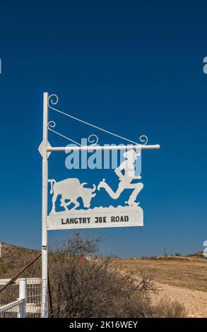 Sign at ranch entrance, US-90 highway, Chihuahuan Desert, near Langtry ...