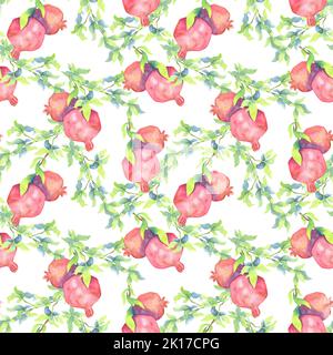 Juicy pomegranates on branches with green leaves and red flowers ...