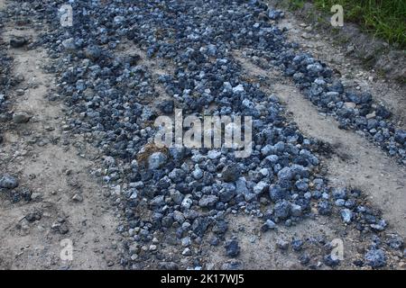 Country road filled with slag from metallurgical production Stock Photo ...