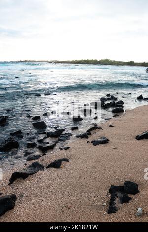 Vertical shot of rocks in the water Stock Photo - Alamy