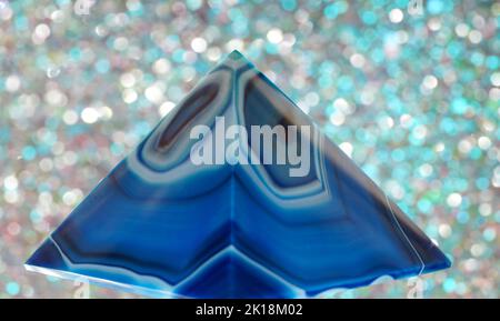 Blue violet pyramid of agate with quartz inclusions or worked as a disc ...