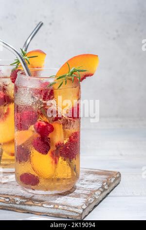 Delicious peach lemonade with soda water and raspberries Stock Photo ...