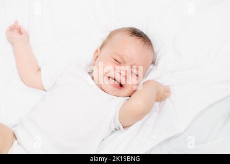 The baby is crying in his crib . The baby 's teeth are teething . Colic ...