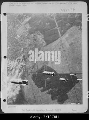 Smoke billows up from the marshalling yards at Ploesti, Rumania during ...