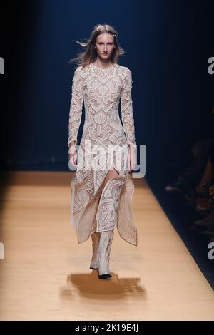 A model walks the runway at the Teresa Helbig fashion show during ...