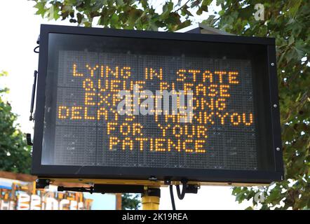 Sign warning of delays as the Queue to see Queen Elizabeth lying in ...