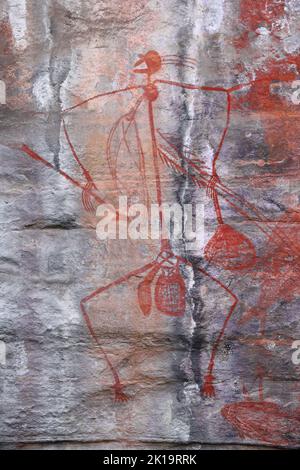Aboriginal rock painting of a Mabuyu figure hunting in a gallery on a ...