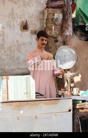 A vertical shallow focus of a Pakistani middle aged male with a ...