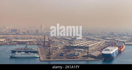 Skyline of Jeddah Islamic Seaport with white traffic control tower ...