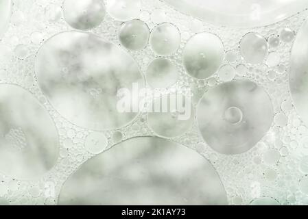 Drops of fat in water. Bubbles of fat close up Stock Photo - Alamy