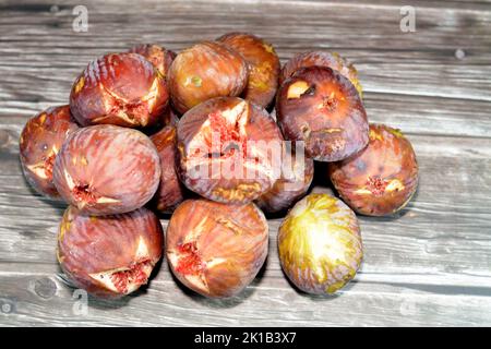 stack of figs parchment fruit isolated on wooden background, fig is the ...
