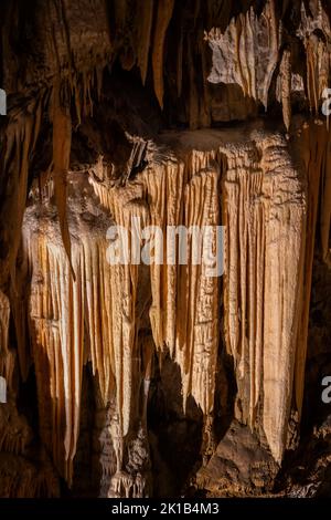 Flowstone rock formation inside a cave.It formed where water flows down ...