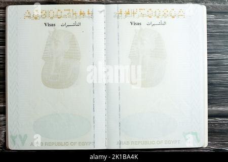 Egyptian passport isolated on wooden background, Arab republic of Egypt ...