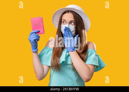 Travel risk. Pandemic holidays. Scared female tourist in protective ...
