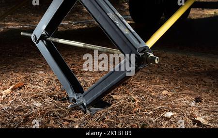 Outrigger on a camper trailer extended to the ground Stock Photo - Alamy