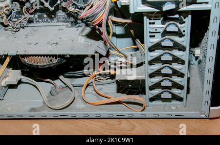 A thick layer of dust covers the internal electronic components of the ...