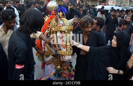 A large number of mourners attend the Chehlum procession to commemorate ...