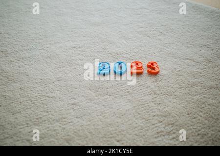 The word 2023 is placed in white fabric Stock Photo - Alamy