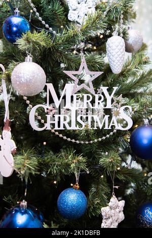 Christmas card with inscription Merry Christmass on christmas tree with ...