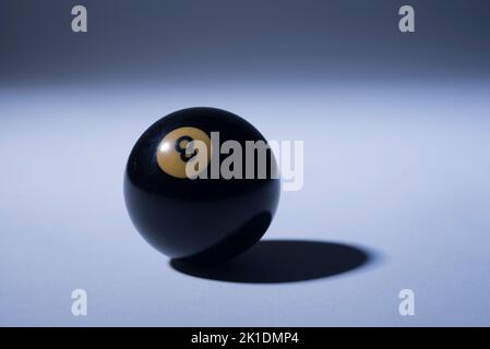 Eight ball symbol for success closeup on eightball with light ...