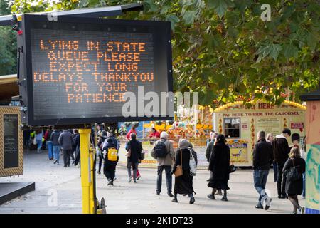 information LED screen warning people joining the queues along the ...
