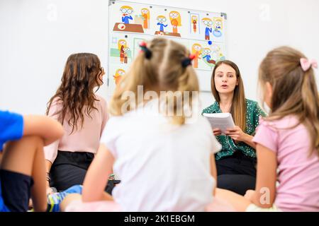 Child occupational therapy session. Group of children doing playful ...