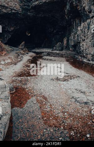 A scenic view of Smoo cave with combined sea cave and freshwater cave ...