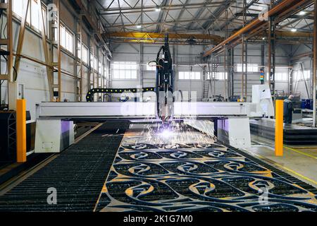 Portal plasma cutting machine operates with metal sheet Stock Photo - Alamy