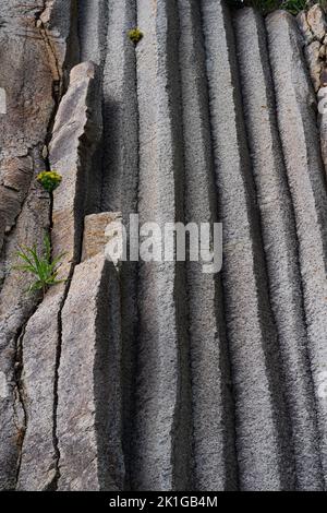 surface of a rock wall formed by columnar basalt Stock Photo - Alamy