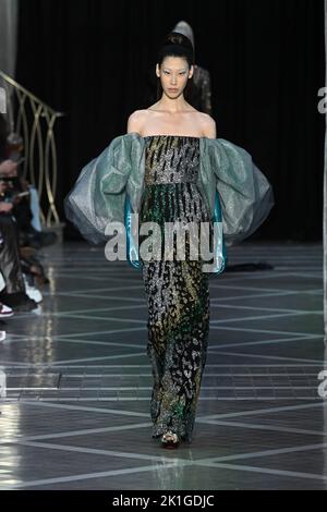 A model walks on the runway at the Halpern fashion show during the ...