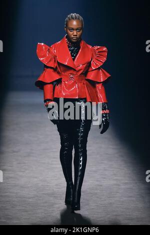 A model walks the runway a design by David Moss during Mercedes-Benz ...