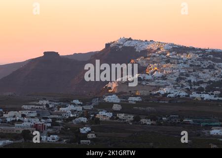 Cityscape and countryside view of Thera, the capital city of Santorini ...