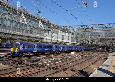 A Siemens Class 380 Desiro Electric train departs Glasgow Central ...