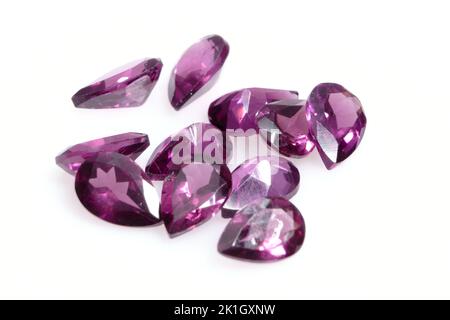 Natural gemstone pink rhodolite garnet on gray background Stock Photo ...