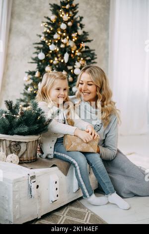 New Year's interior. Christmas tree bed with soft blue back and ...