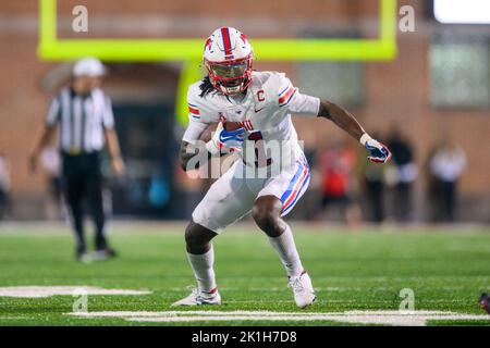 SMU wide receiver Rashee Rice, right, is tackled by East Carolina ...