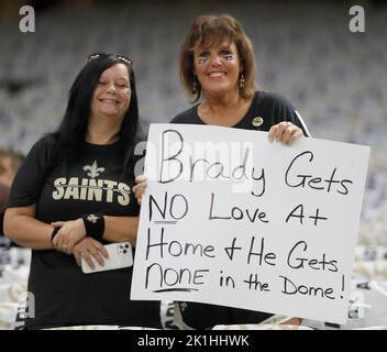 A Tampa Bay Buccaneers fan holds up a sign during the first half of an ...
