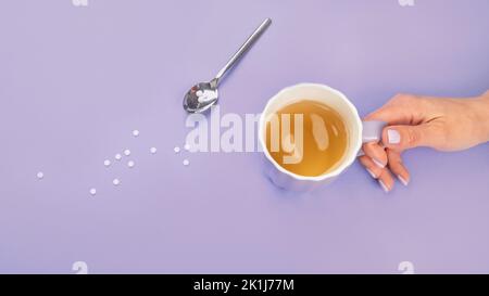 Tea cup with suagr substitute on color background. The concept of ...