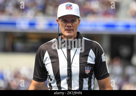 Referee Clay Martin (19) walks on the field during the first half of an ...